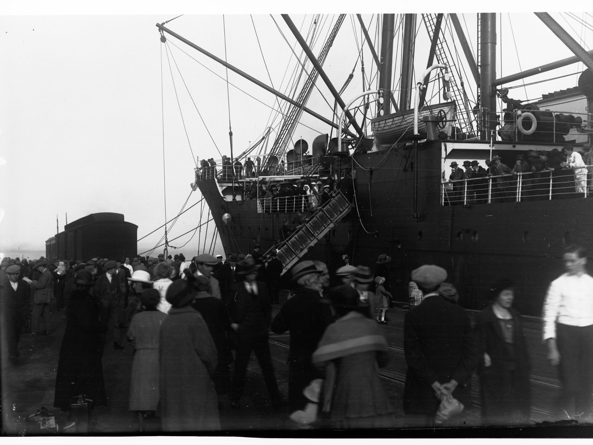 Ship docked at Outer Harbour - Group of people on wharf | History Trust