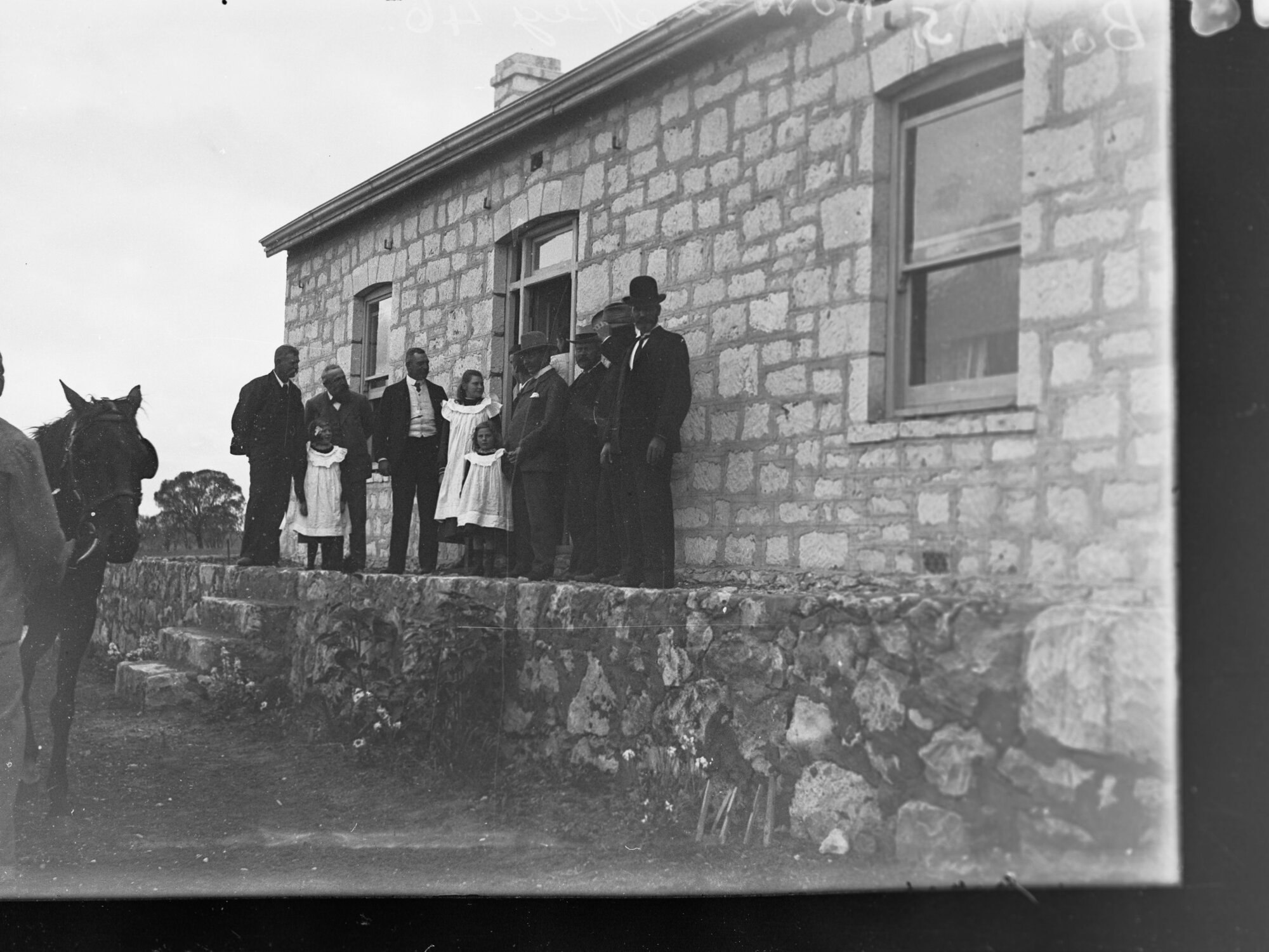 Group of people gathered outside a building | History Trust
